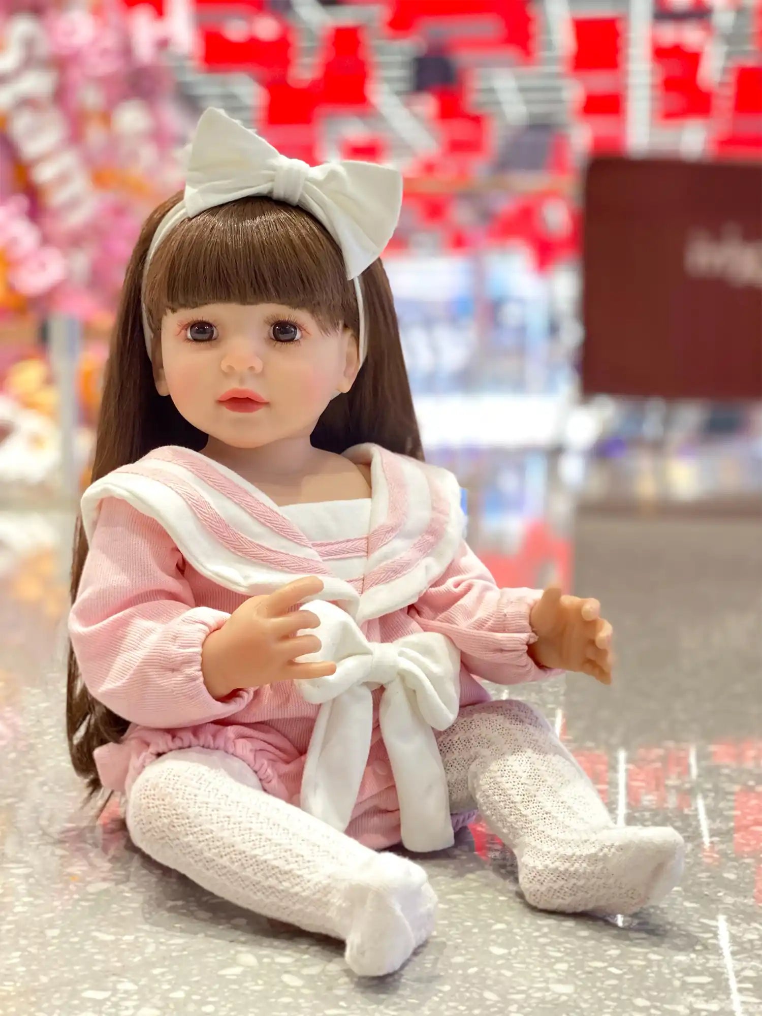 Adorable reborn toddler doll - Realistic Girl in Pink with Bow