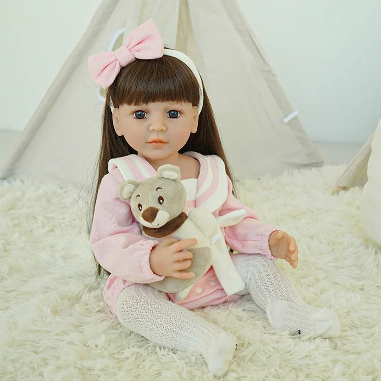 Adorable reborn toddler doll - Realistic Girl in Pink with Bow