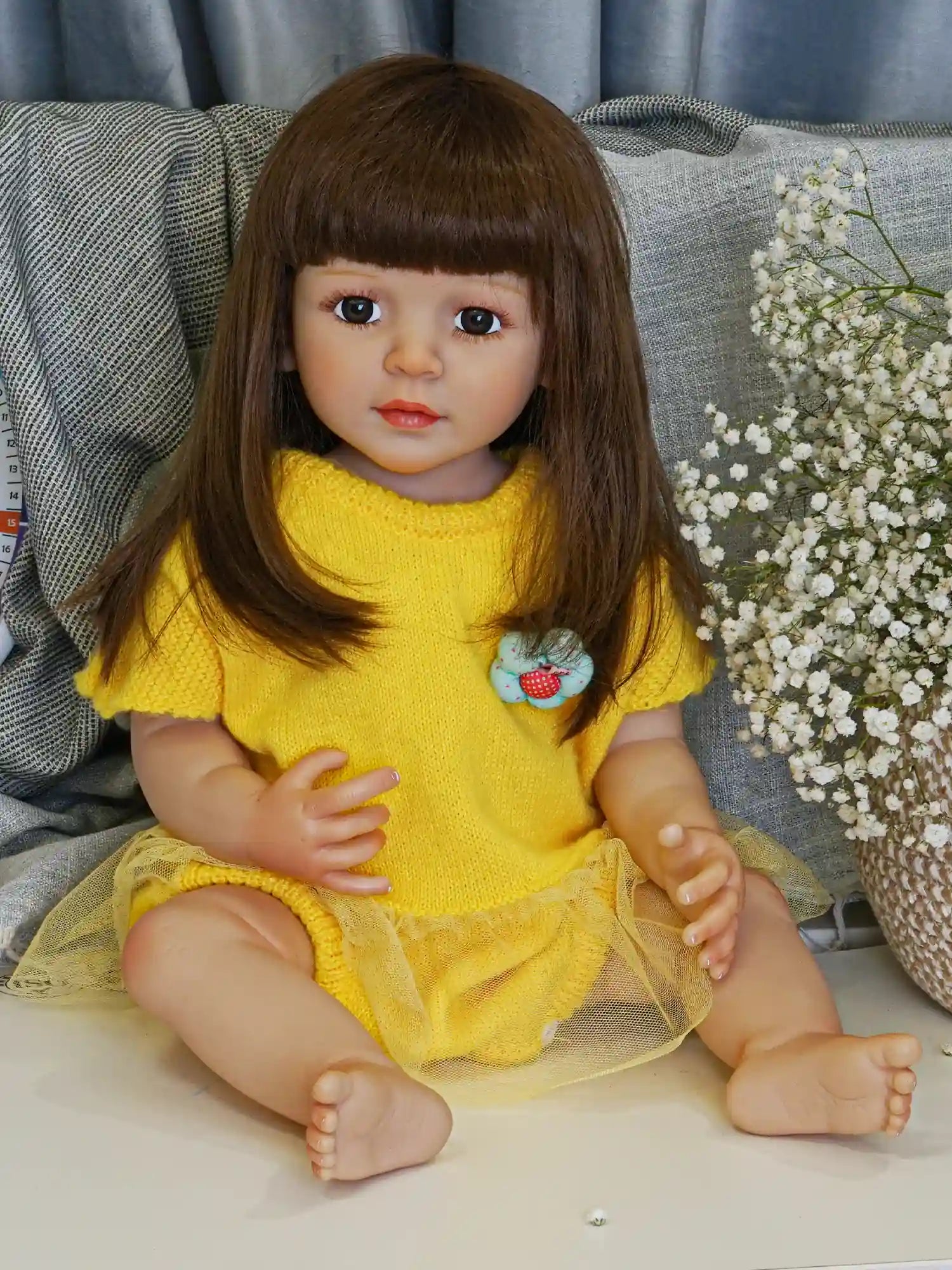 Chimidoll - playful toddler doll in a yellow outfit with long hair